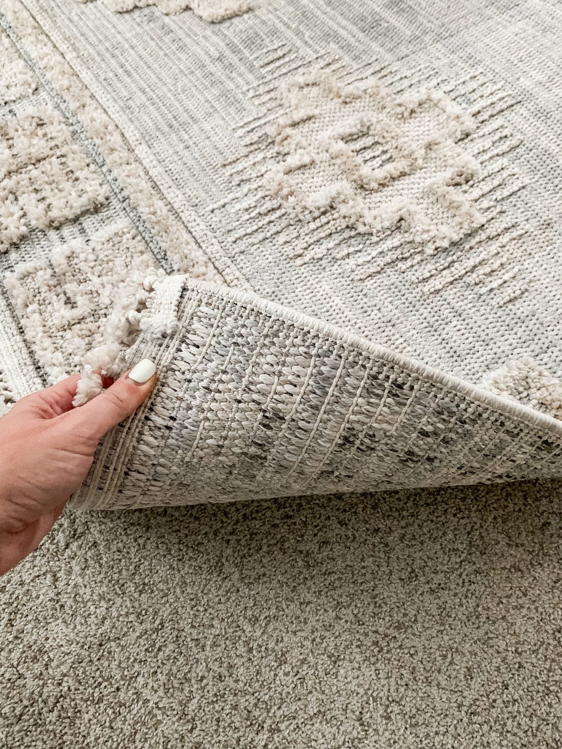 The 11 Best Rugs For Carpet That Won't Move | Bless This Nest